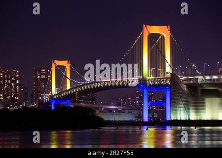 Night view of Odaiba Seaside Park and Rainbow Bridge in Tokyo, Japan ...