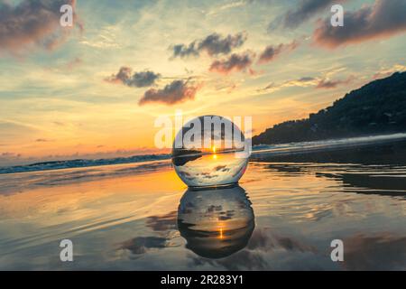 Magnificent sky above the crystal ball on the beach. The beautiful ...