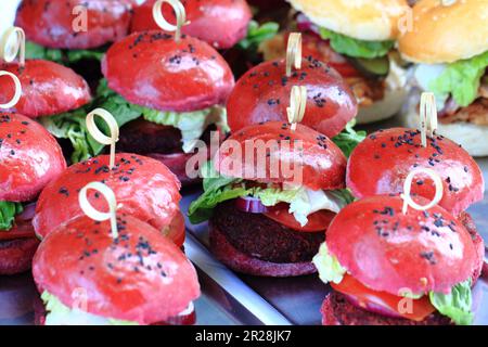 red vegan burgers as very nice background Stock Photo - Alamy
