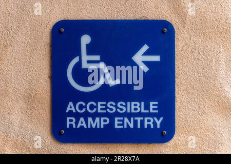 Ramp way with the accessible ramp entry sign for disabled Stock Photo ...