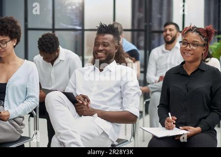Business crowd in auditorium listeing to speech Stock Photo - Alamy
