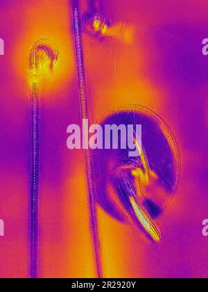 A thermal image of a shower faucet captured with an infrared thermal ...