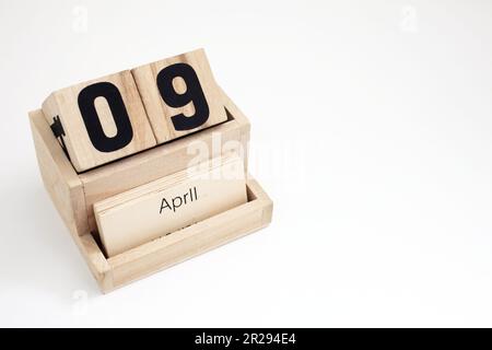 Wooden perpetual calendar showing the 9th of May Stock Photo - Alamy