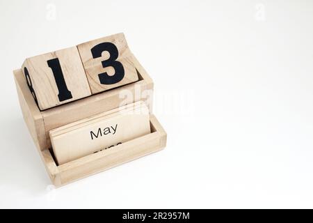 Wooden perpetual calendar showing the 13th of December Stock Photo - Alamy
