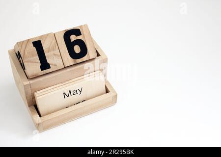 Wooden perpetual calendar showing the 16th of April Stock Photo - Alamy
