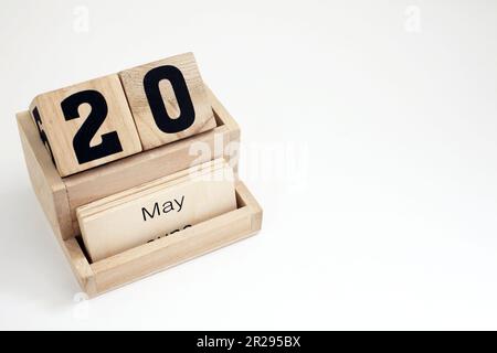 Wooden perpetual calendar showing the 20th of July Stock Photo - Alamy