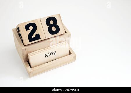 Wooden perpetual calendar showing the 28th of June Stock Photo - Alamy