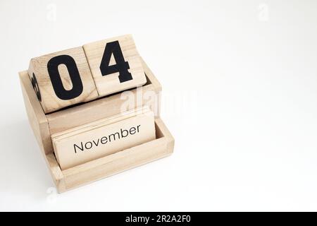 Wooden perpetual calendar showing the 4th of August Stock Photo - Alamy
