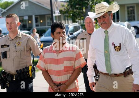 San Jacinto County Sheriff Greg Capers talks to investigators at the ...