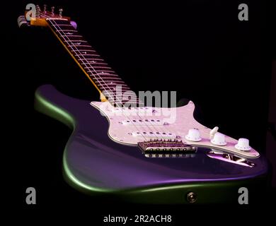 Stratocaster style electric guitar floating on black background Stock ...