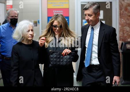 Khazar Elyassnia, center, arrives for the arraignment of Nima Momeni ...