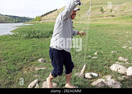 Fishing on the Tigris River in central Baghdad near the Republic Bridge ...
