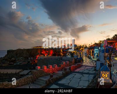 Cafes and restaurants on the cliffs at sunset in Hadaba, Sharm el ...