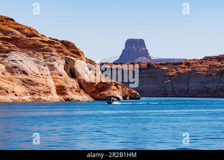 Vacationers in power boat explore Lake Powell; Tower Butte beyond; Glen ...