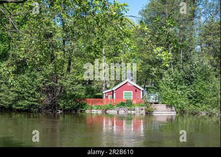 View acrooss Motala river from waterfront park Åbackarna towards ...