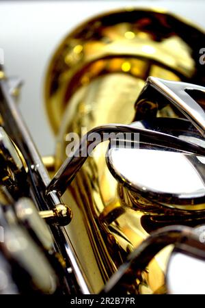 close up on alto saxophone details, black background, short depth of ...