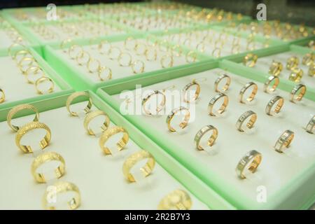 Gold jewelry engagement rings show in retail store window display ...