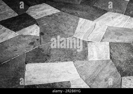 A patterned stone floor adorns the space, displaying intricate designs ...