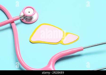 Pink paper liver with stethoscope on white background Stock Photo - Alamy