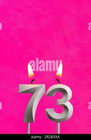 Birthday candle number 73 on white background Stock Photo - Alamy