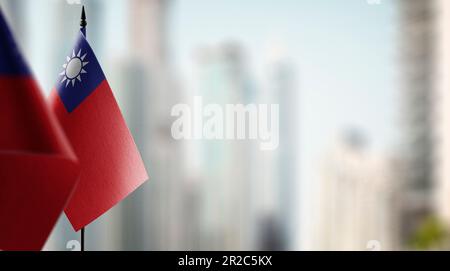 Small flags of the Taiwan on an abstract blurry background Stock Photo ...