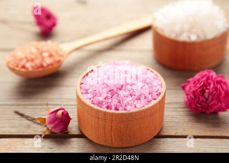 Different types of salt with roses on grey background.. Top view Stock ...