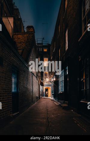 A mysterious and hidden old back alley in London at night Stock Photo ...