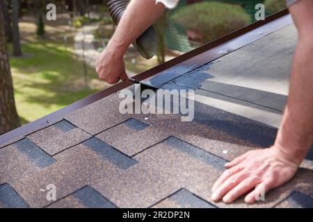 Worker's hands are smeared with waterproofing mastic for the roof Stock ...