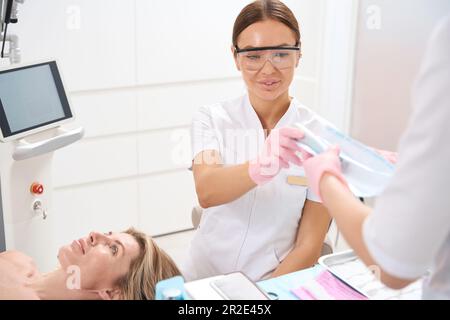 Aesthetic medicine clinic staff at the workplace Stock Photo - Alamy