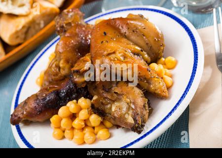 Roasted pettitoes with chickpeas Stock Photo - Alamy
