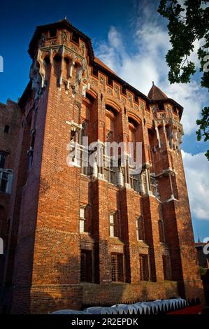 Malbork Castle in northern Poland shows red brick walls, a square keep ...