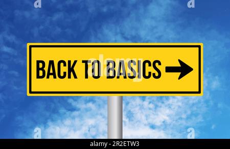Back to basics road sign on blue sky background Stock Photo - Alamy