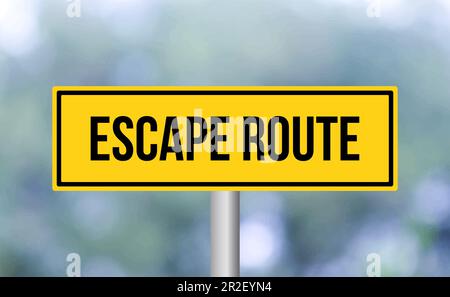 Escape route road sign on sky background Stock Photo - Alamy