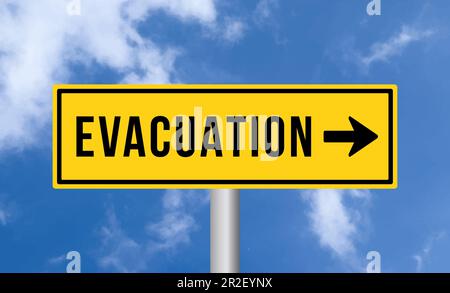Evacuation road sign on blue sky background Stock Photo - Alamy