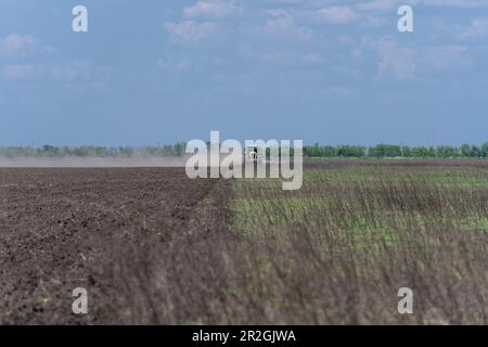Recently de-mined field is plowed for planting at farm Pershe Travnia ...