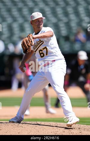 Oakland Athletics pitcher Garrett Acton, left, during a baseball game ...