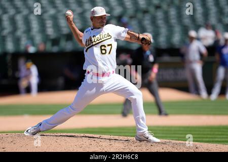 Oakland Athletics pitcher Garrett Acton, left, during a baseball game ...
