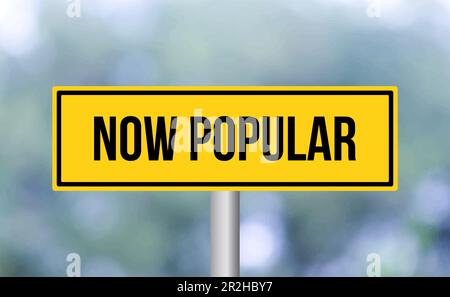 Now popular road sign on cloudy sky background Stock Photo - Alamy