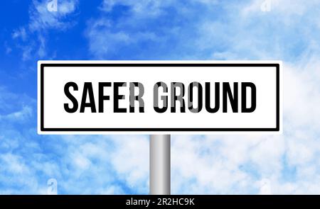 Safer ground road sign on blur background Stock Photo - Alamy