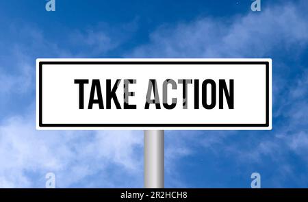 Take action road sign on sky background Stock Photo - Alamy