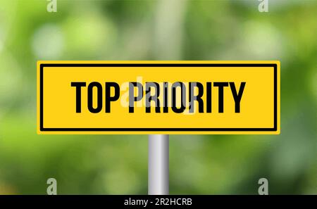 Top priority road sign on cloudy sky background Stock Photo - Alamy