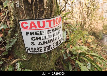 Free Range Children kids road safety sign at the head of a woodland ...