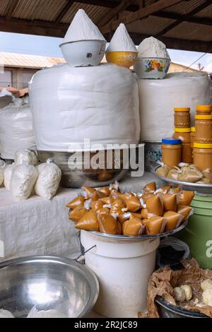 Selling cassava flour, tapioca and peanut butter at the weekly market ...