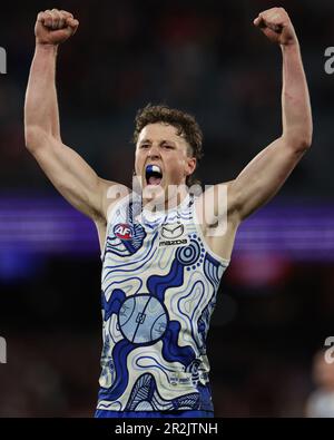Nick Larkey of North Melbourne celebrates with team mates after kicking ...