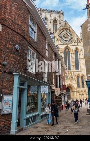 York Minster and shops on Minster Gates viewed from the Stonegate in ...