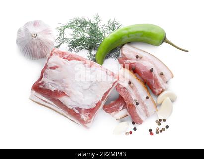 Pieces of pork fatback and different spices on white background Stock ...