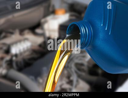 Pouring motor oil from blue container container, closeup Stock Photo ...