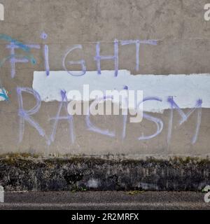 Graffiti reading "Fight racism", Illustration, France Stock Photo - Alamy