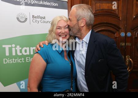 Alliance Party candidate David Bell (right) celebrates winning a seat ...