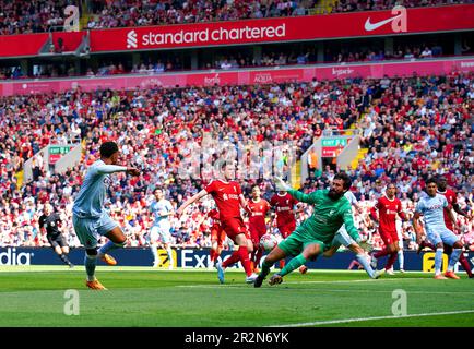 Liverpool goalkeeper Alisson Becker saves at the feet of Paris Saint ...